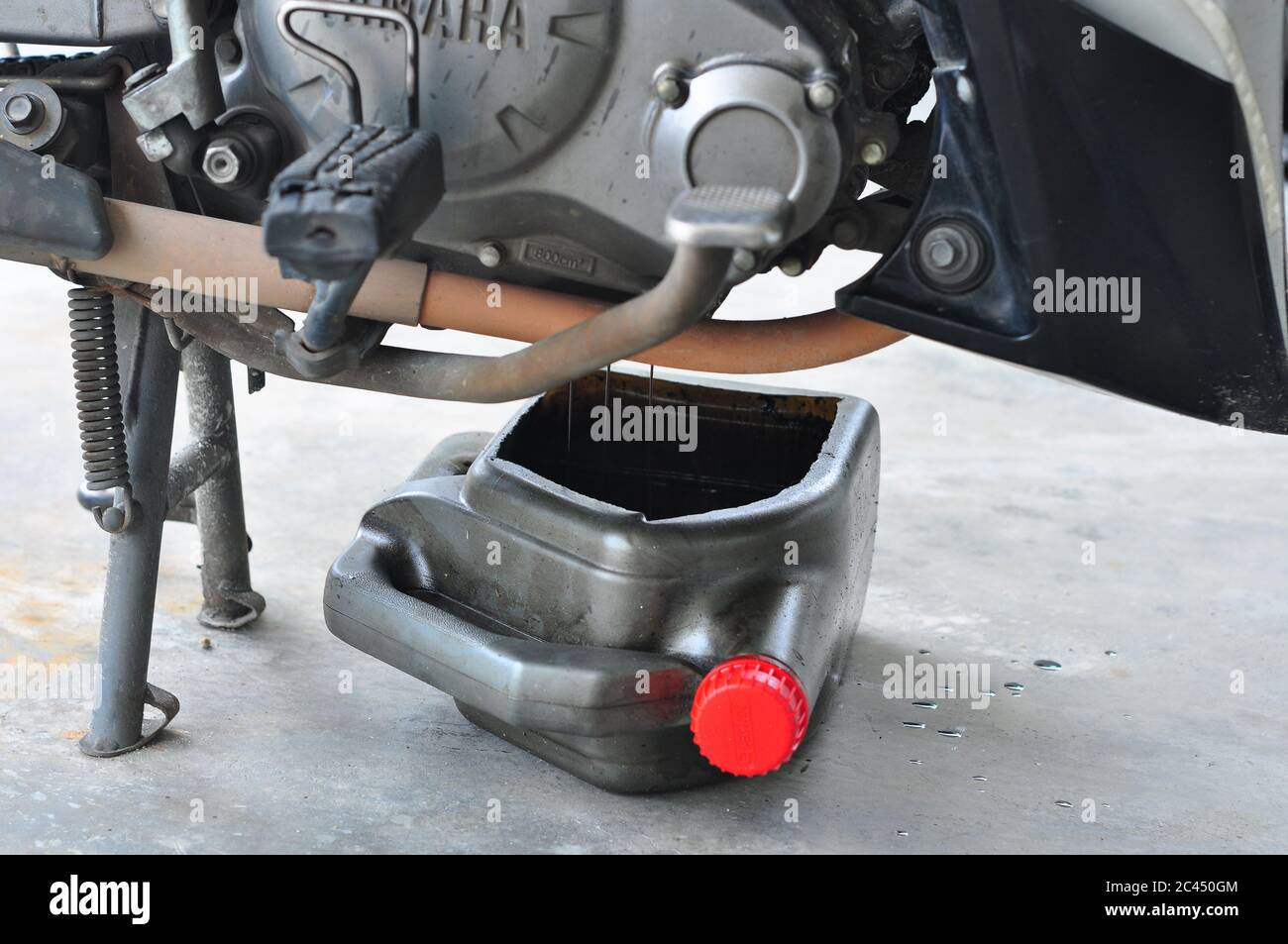Pouring yellow liquid motorcycle fuel hi-res stock photography and ...