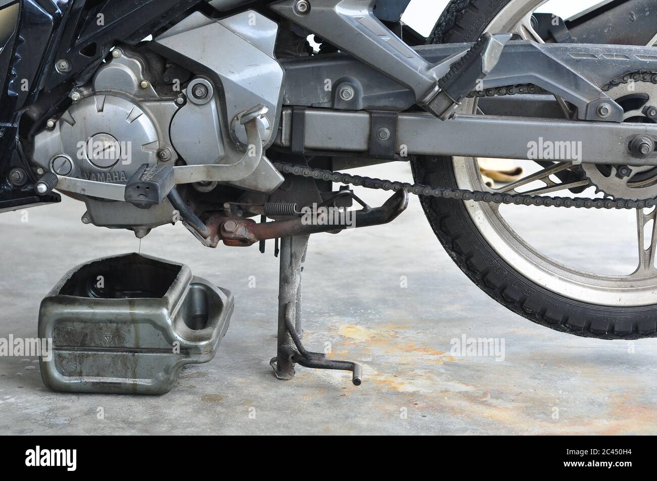 Pouring yellow liquid motorcycle fuel hi-res stock photography and ...