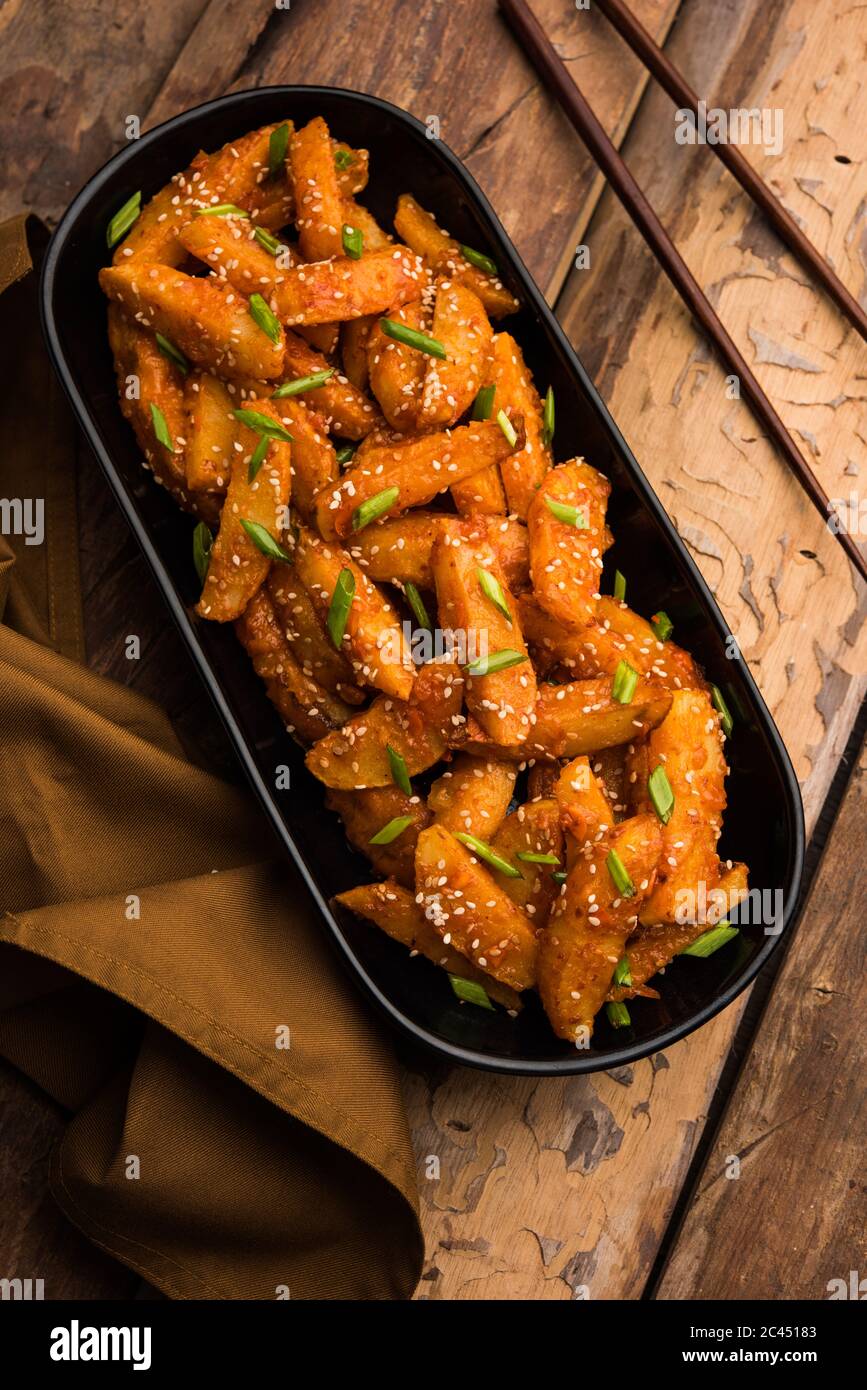 Honey Chilli Potato is a popular Indian Chinese food Stock Photo - Alamy