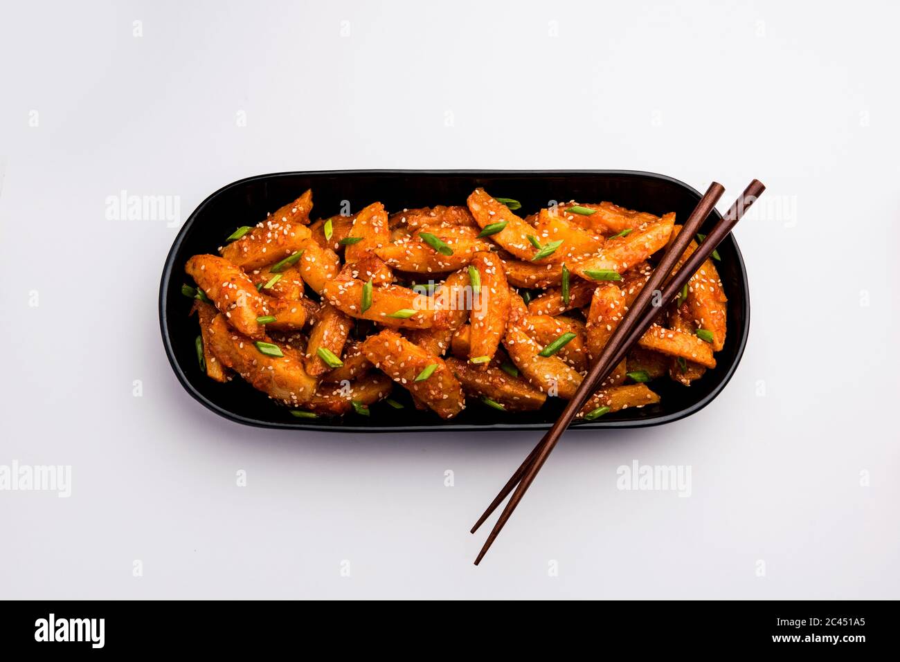 Honey Chilli Potato is a popular Indian Chinese food Stock Photo - Alamy