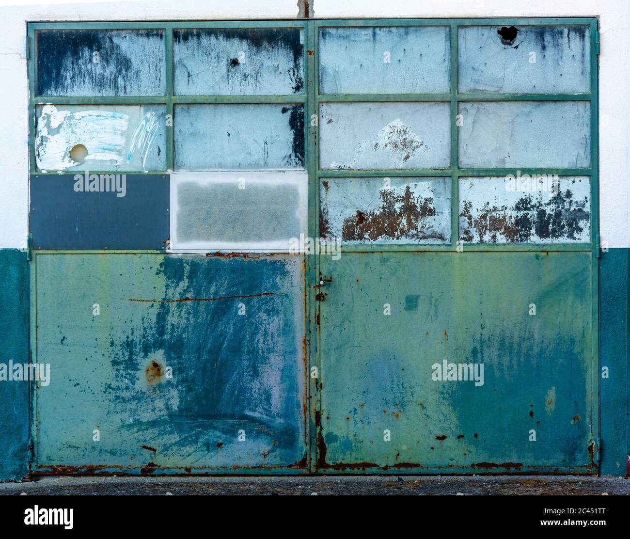 Windows in facade of an neglected workshop Stock Photo - Alamy