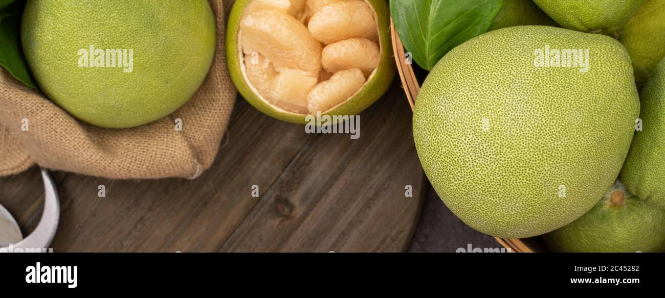 Fresh pomelo, pummelo, grapefruit, shaddock on black background, fruit ...