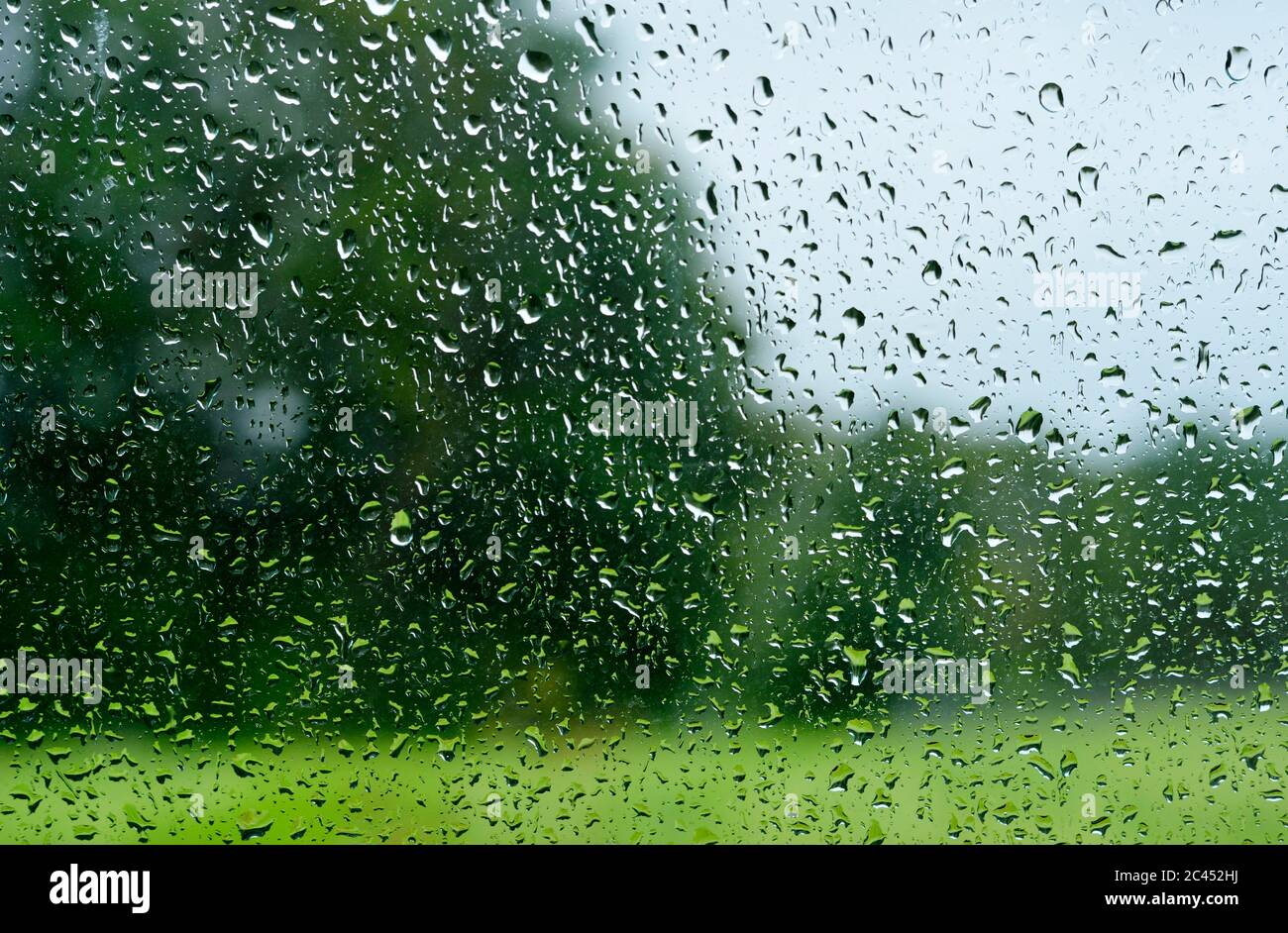 Landscape in rain through the window Stock Photo - Alamy