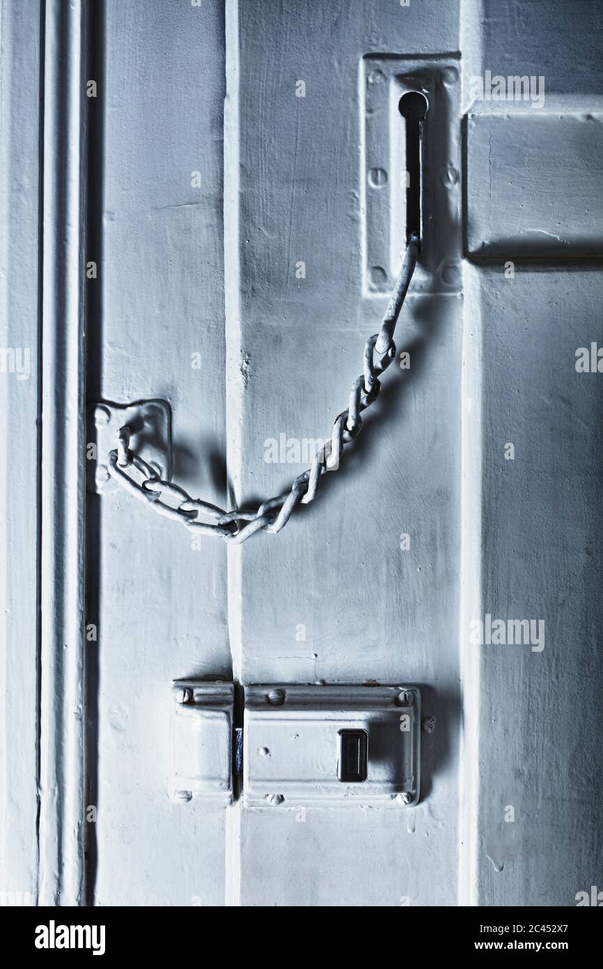 Door with door chain Stock Photo - Alamy
