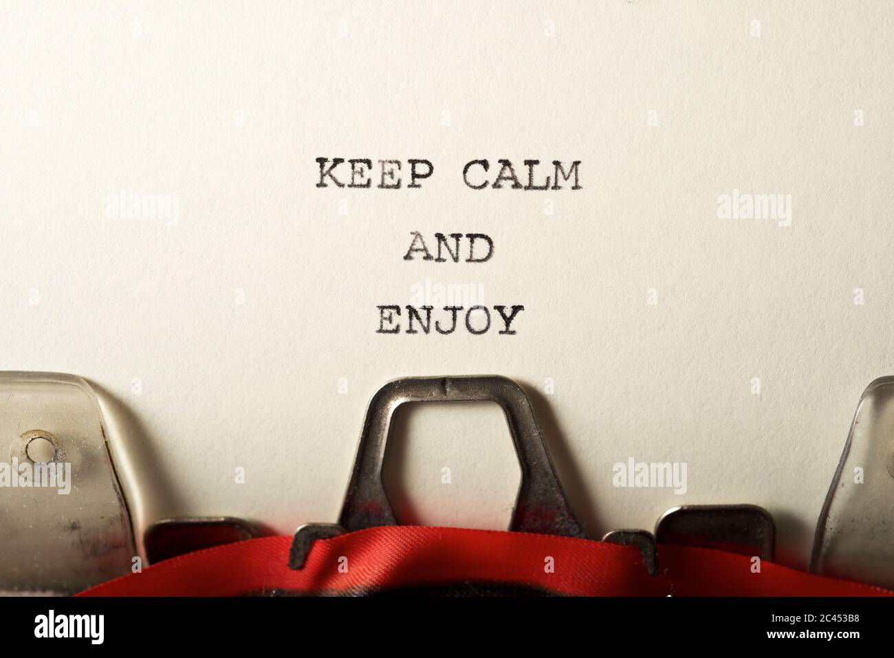 Keep calm and enjoy text written with a typewriter Stock Photo - Alamy