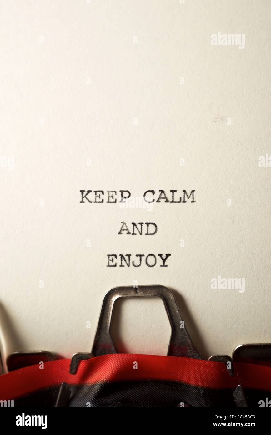Keep calm and enjoy text written with a typewriter Stock Photo - Alamy