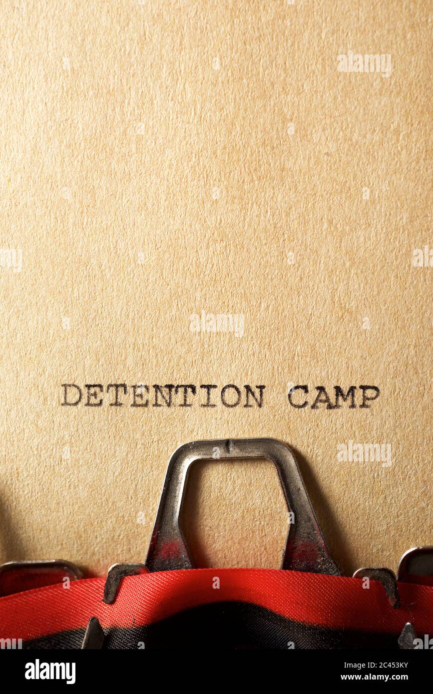 Detention camp text written on a paper Stock Photo - Alamy