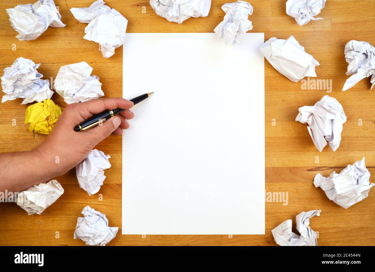 Left handed person writing ideas Stock Photo - Alamy