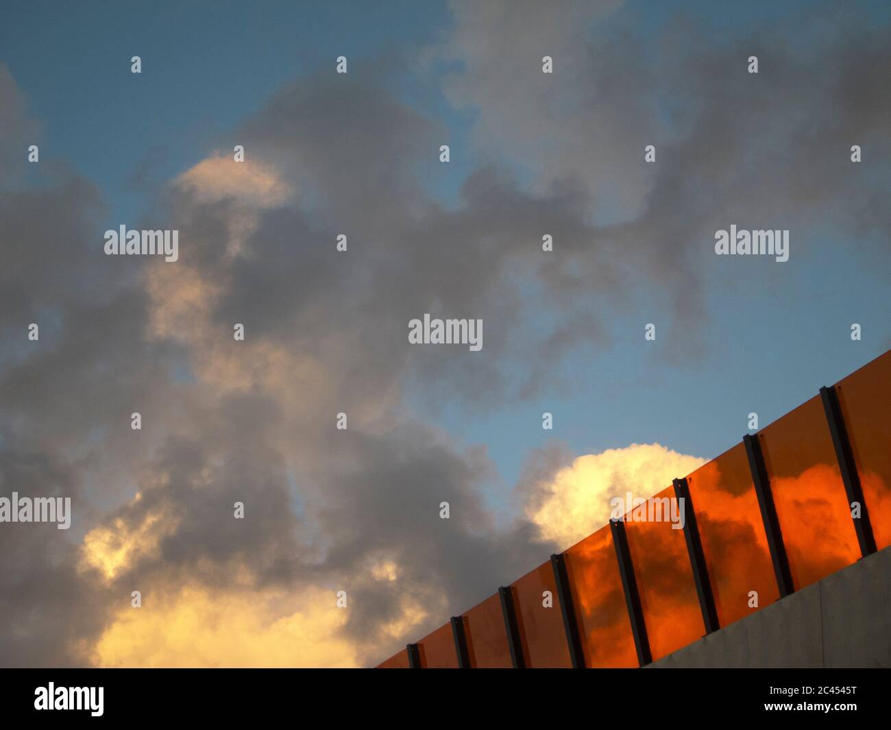 Corner of a skyscraper under clouds Stock Photo - Alamy