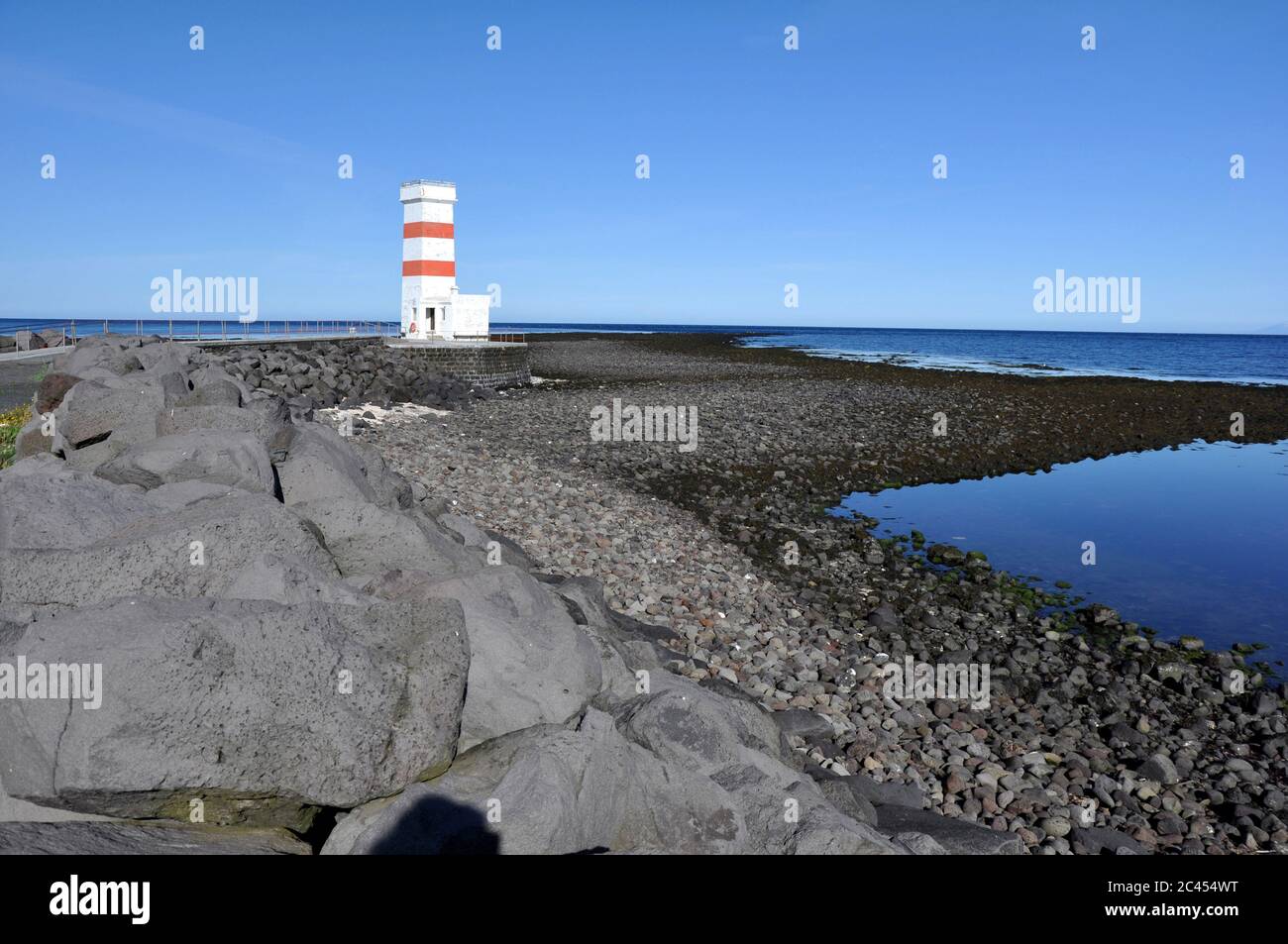 Lighthouse by the sea in Gardur, Iceland Stock Photo - Alamy