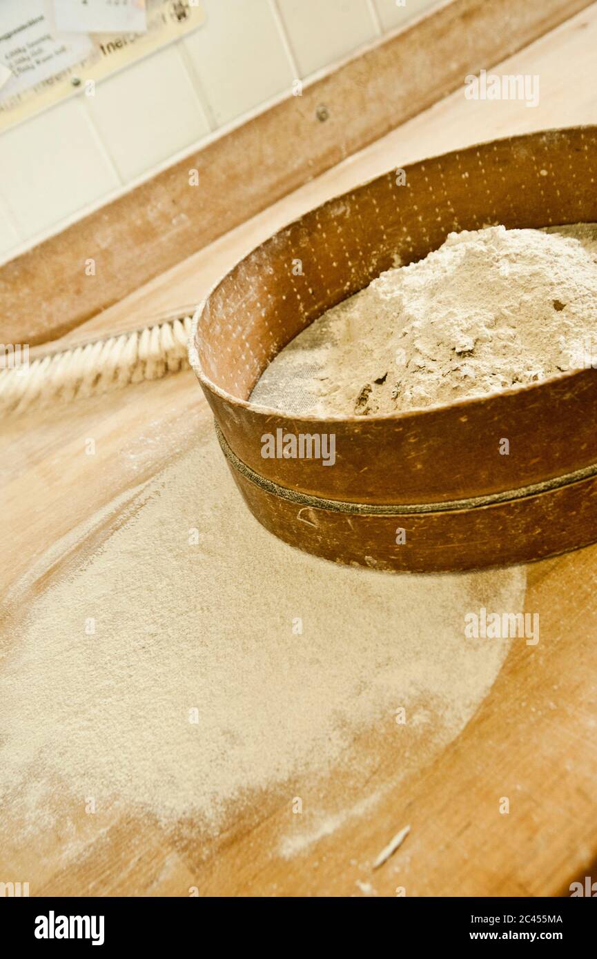 Baking pan with flour on a countertop Stock Photo - Alamy
