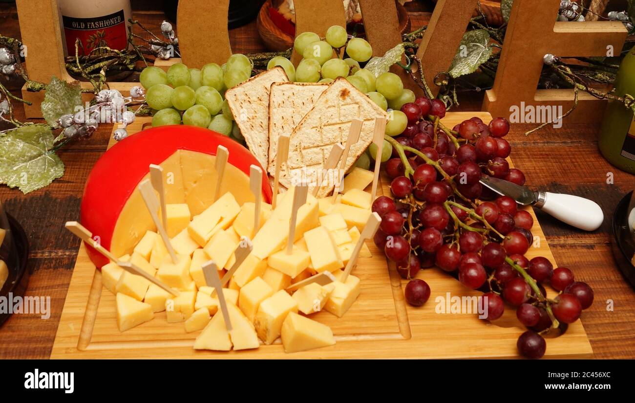 Cheese assortment with grapes stand-up meal in the party Stock Photo ...