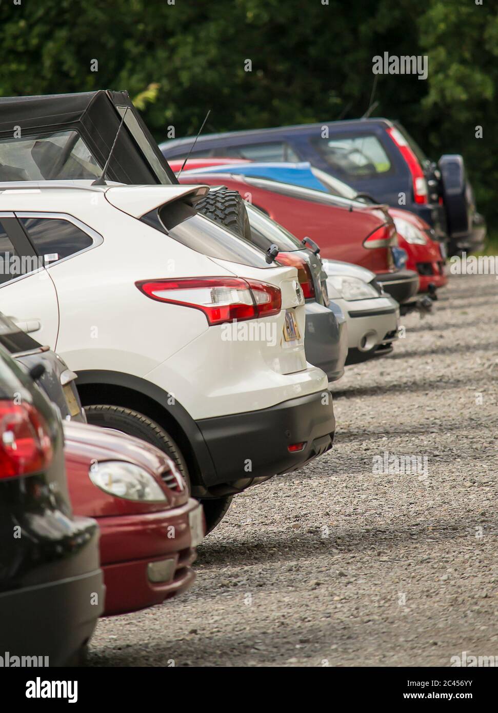 Small outdoor car park with parked cars Stock Photo - Alamy
