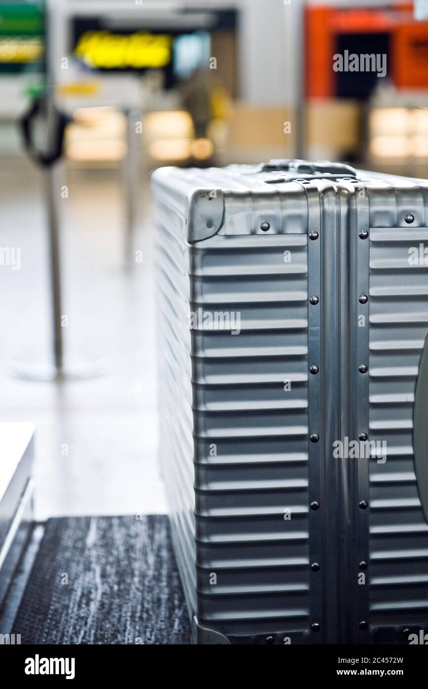 Metal case at an airport check in Stock Photo - Alamy