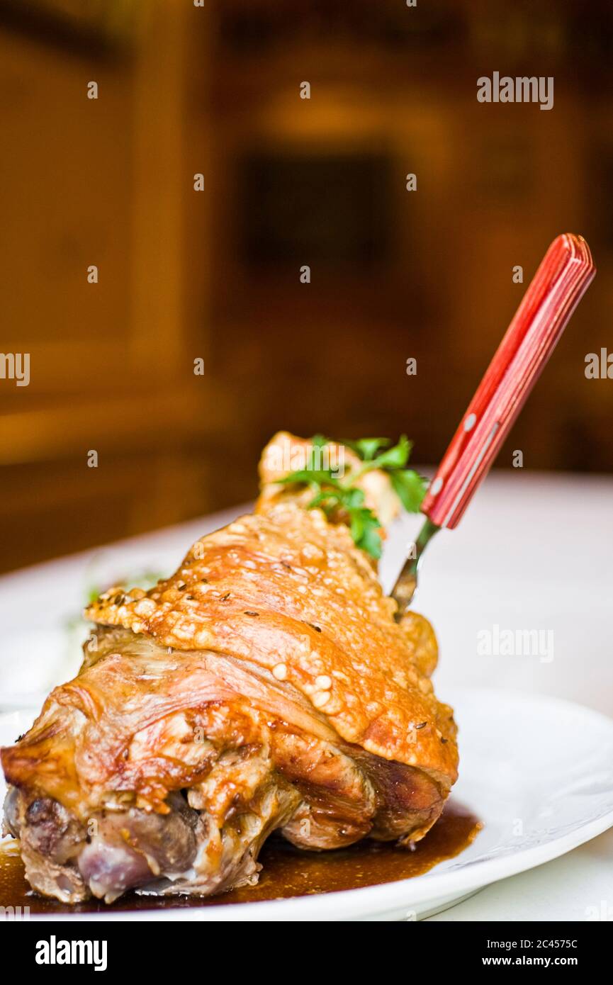 Pork knuckle on a plate Stock Photo - Alamy