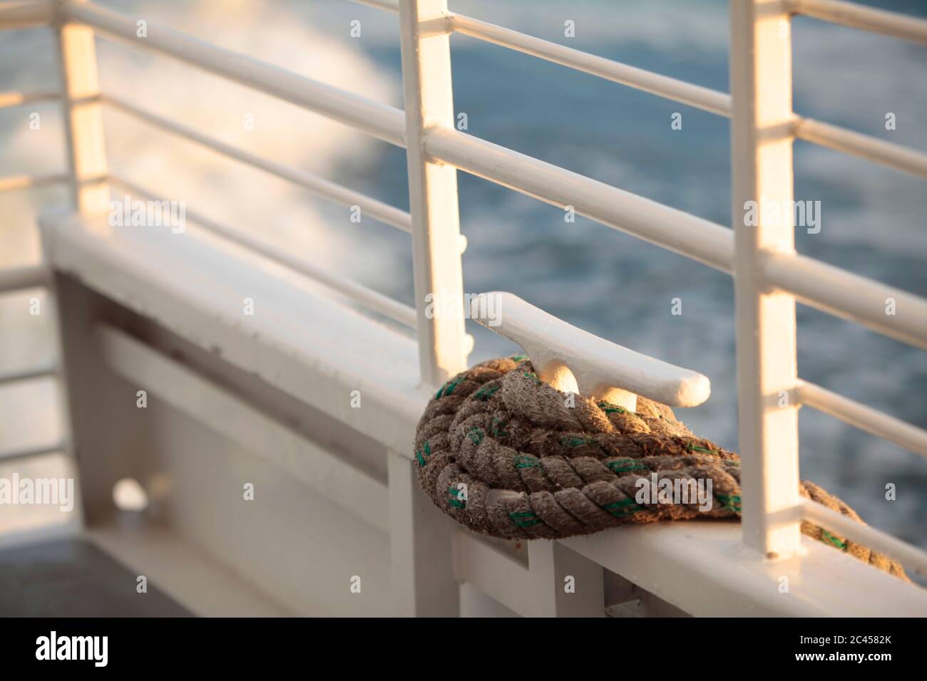 Rope on the railing of a ship Stock Photo - Alamy