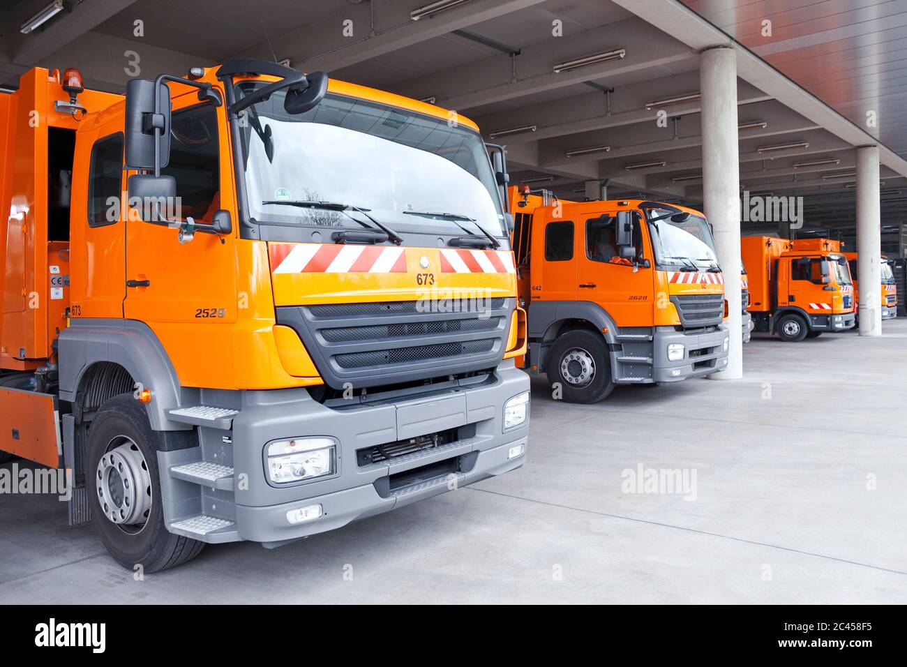 Garbage trucks on the grounds of the waste management company in Munich ...