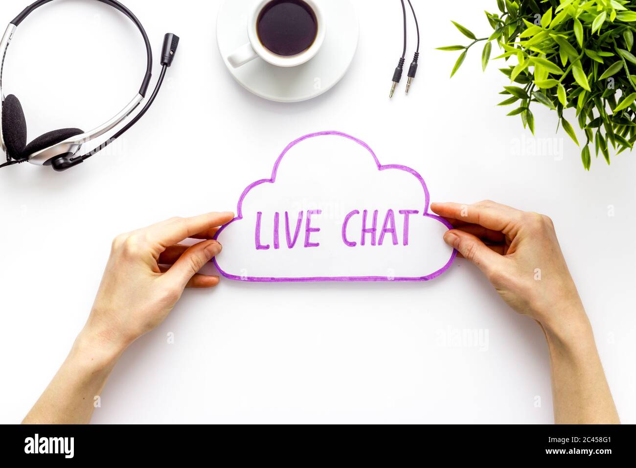 Live chat concept - bubble in hands on white desk top view Stock Photo ...