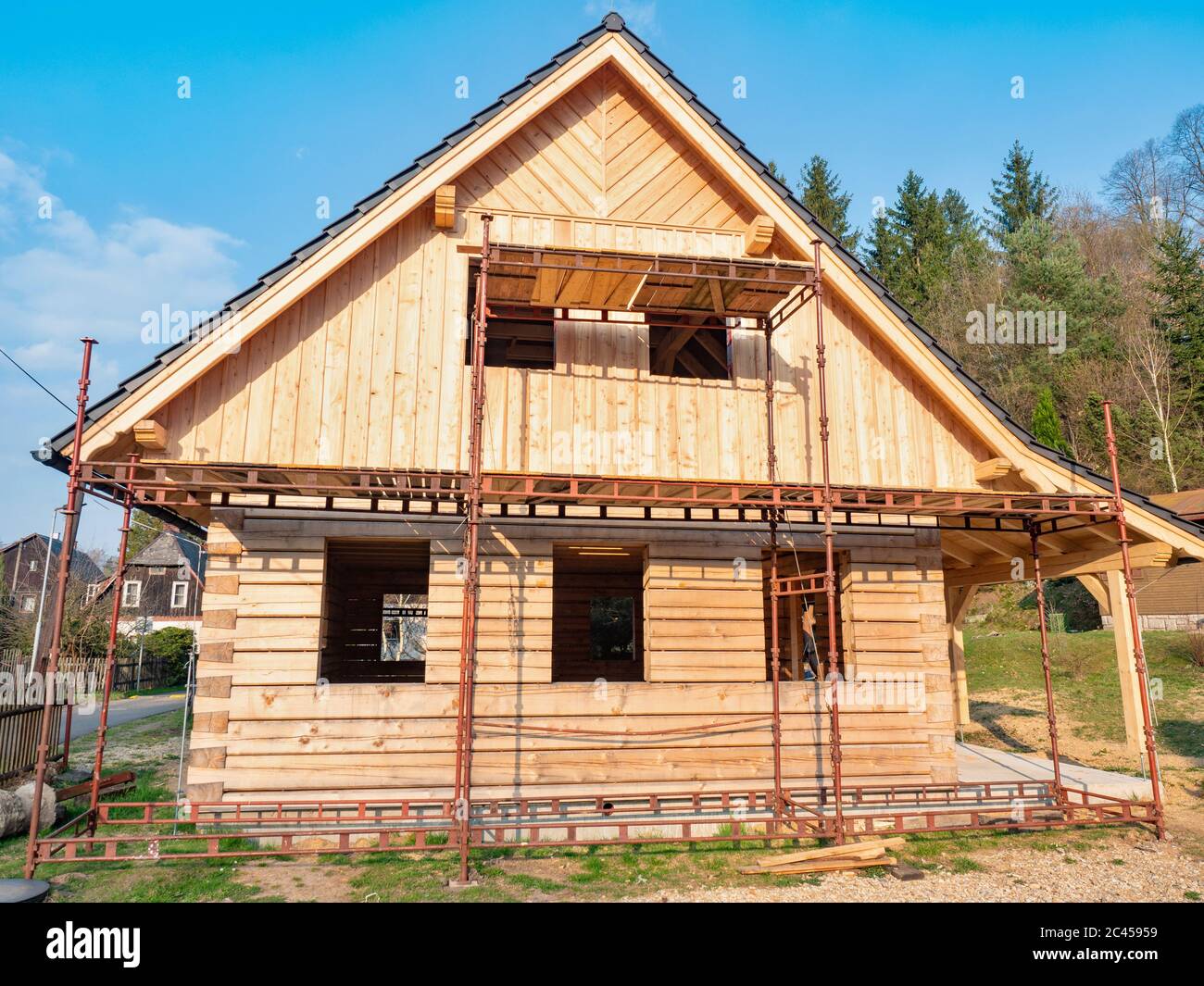 Foldable scaffolding at new wooden country house under construction ...