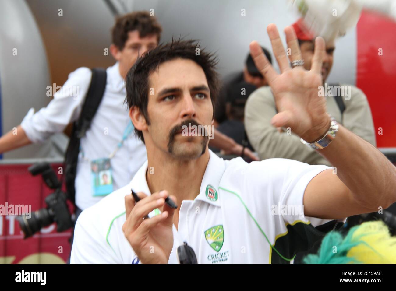 Mitchell Johnson with his moustache signed autographs for Australian ...