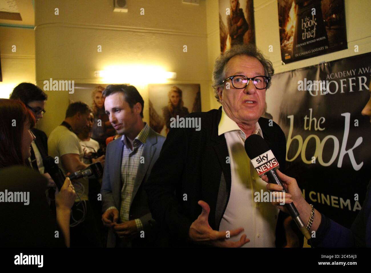 Geoffrey Rush and Author Markus Zusak are interviewed at the red carpet ...