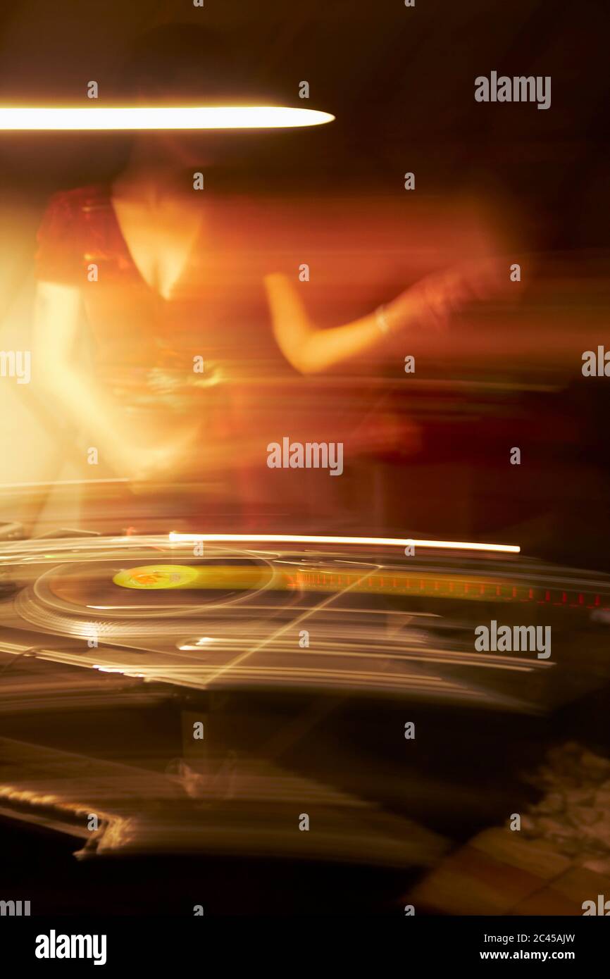 Woman is dancing on the turntable Stock Photo - Alamy