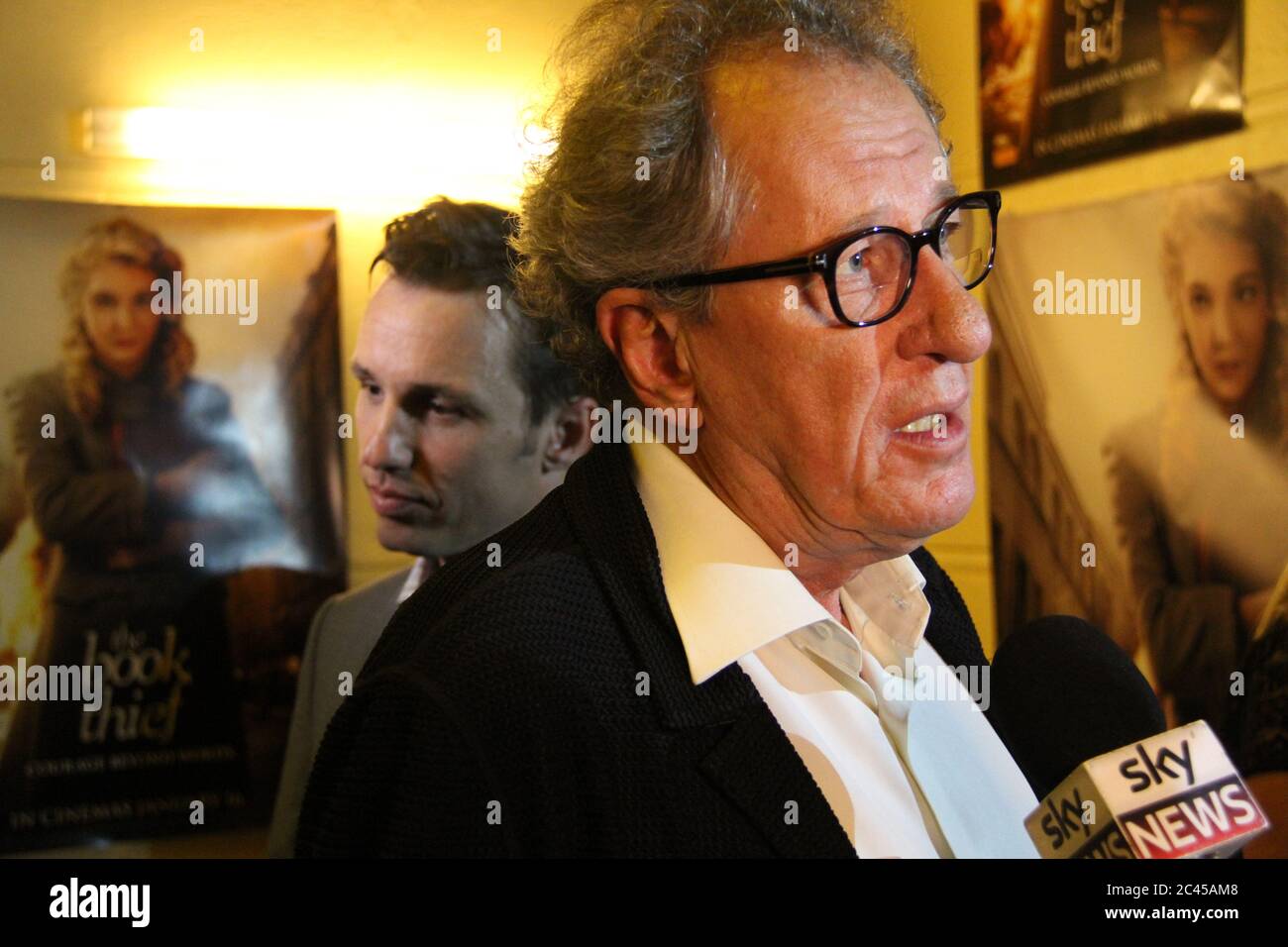 Geoffrey Rush and Author Markus Zusak are interviewed at the red carpet ...