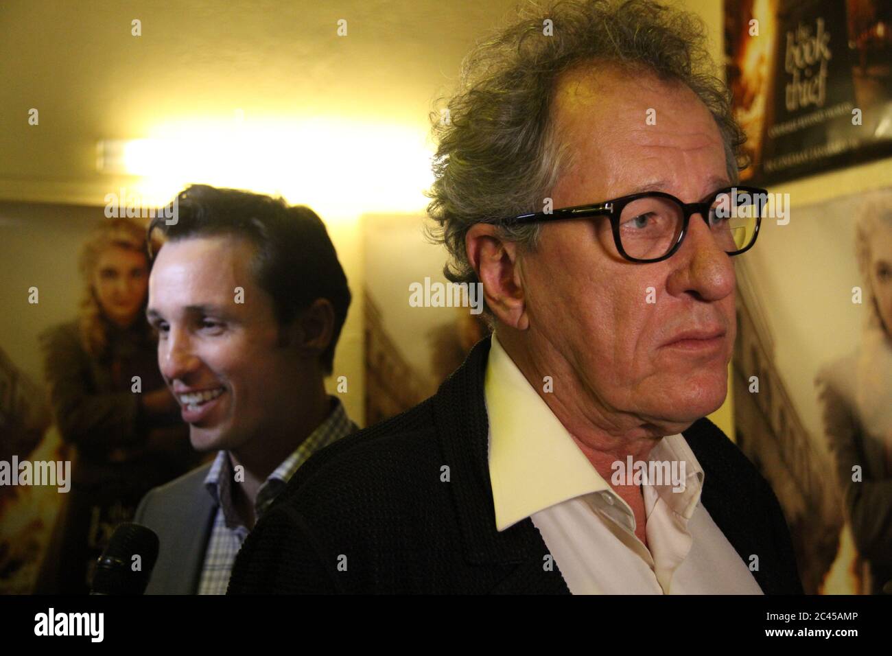 Geoffrey Rush and Author Markus Zusak are interviewed at the red carpet ...