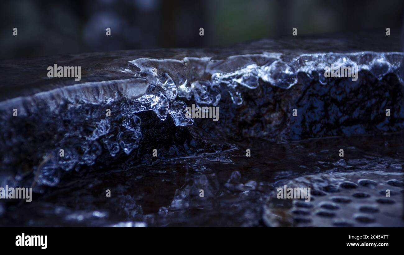 Closeup shot of a stone fountain with dripping water Stock Photo - Alamy