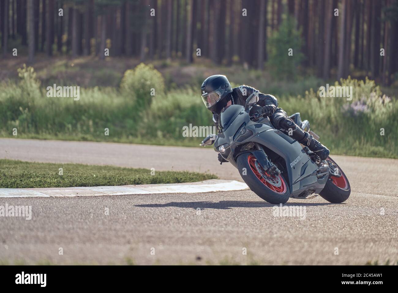 Speeding round a race circuit hi-res stock photography and images - Alamy