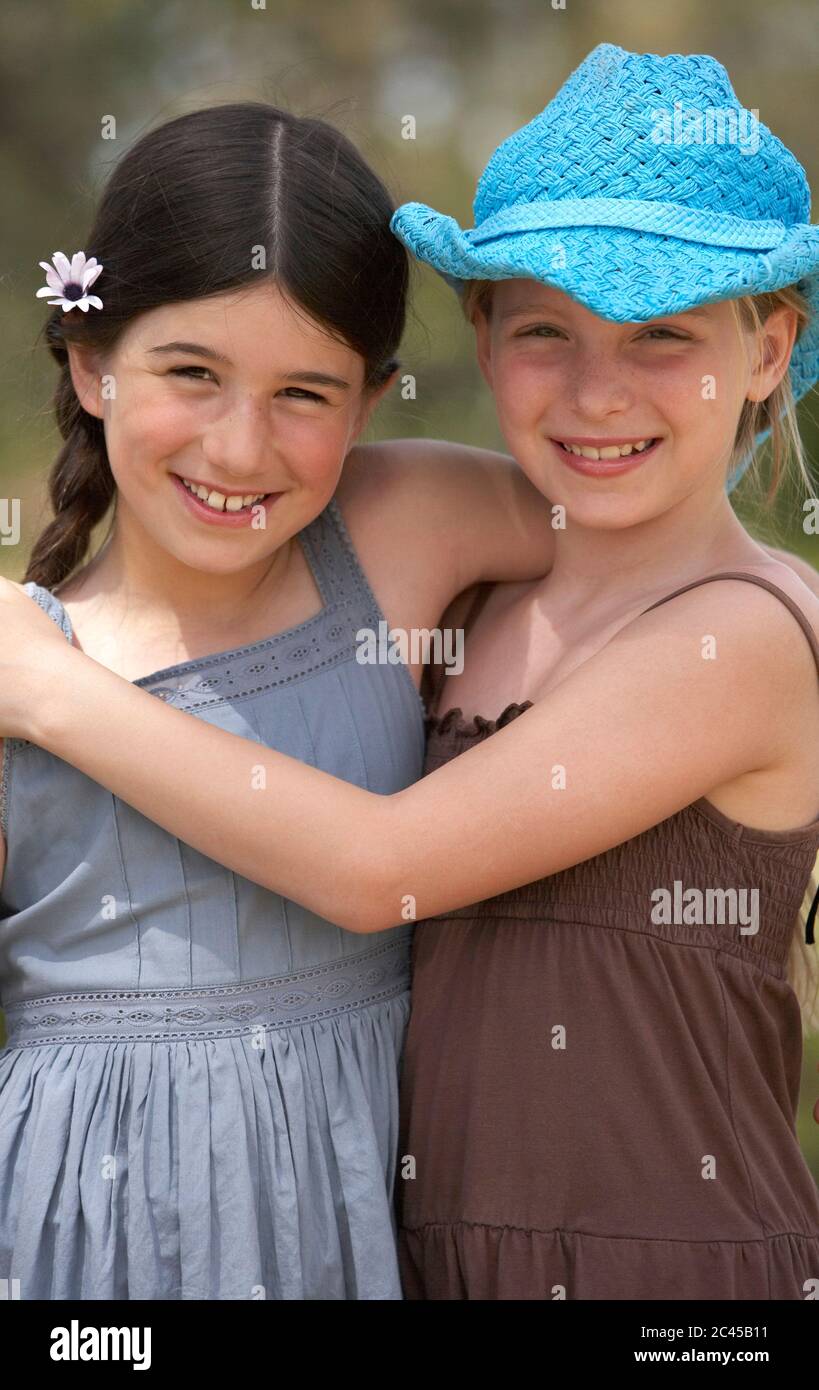 Two girls hug each other outdoors Stock Photo - Alamy Two girls hug each other outdoors Stock Photo - Alamy