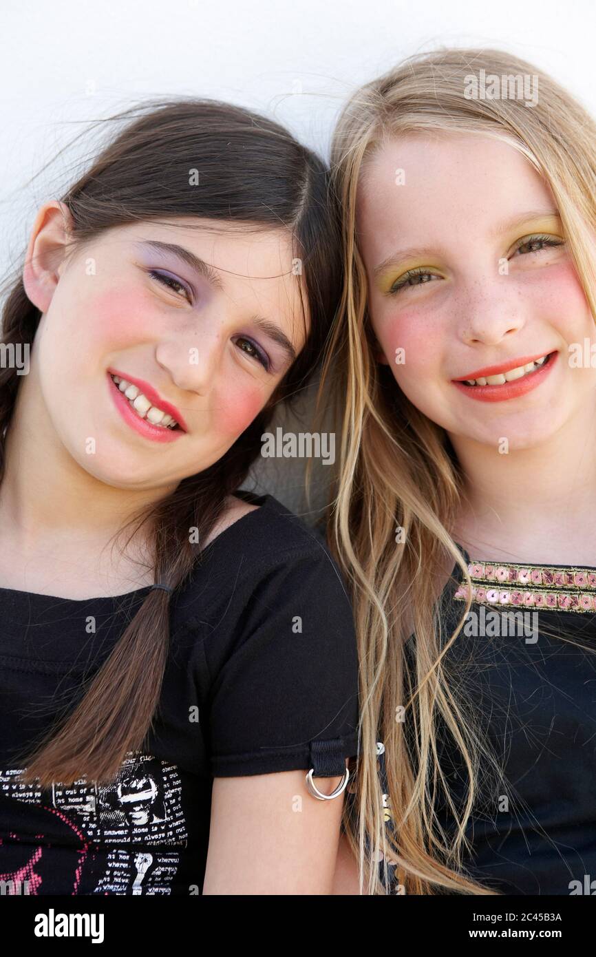 Two smiling girls made up, portrait Stock Photo - Alamy