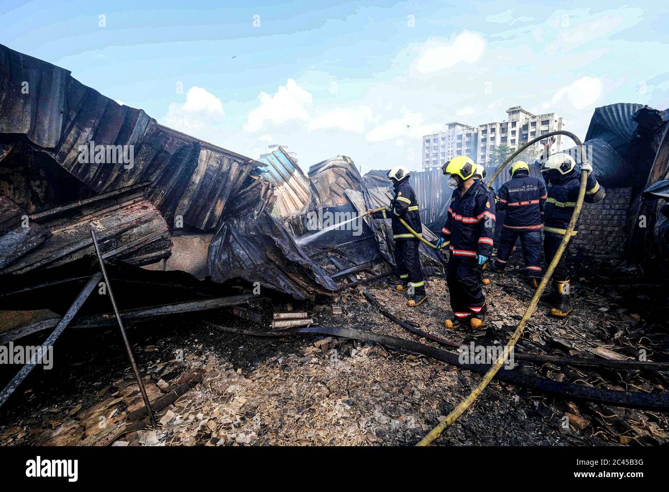 Mumbai, India. 23rd June, 2020. Indian fire fighters douse fire at ...