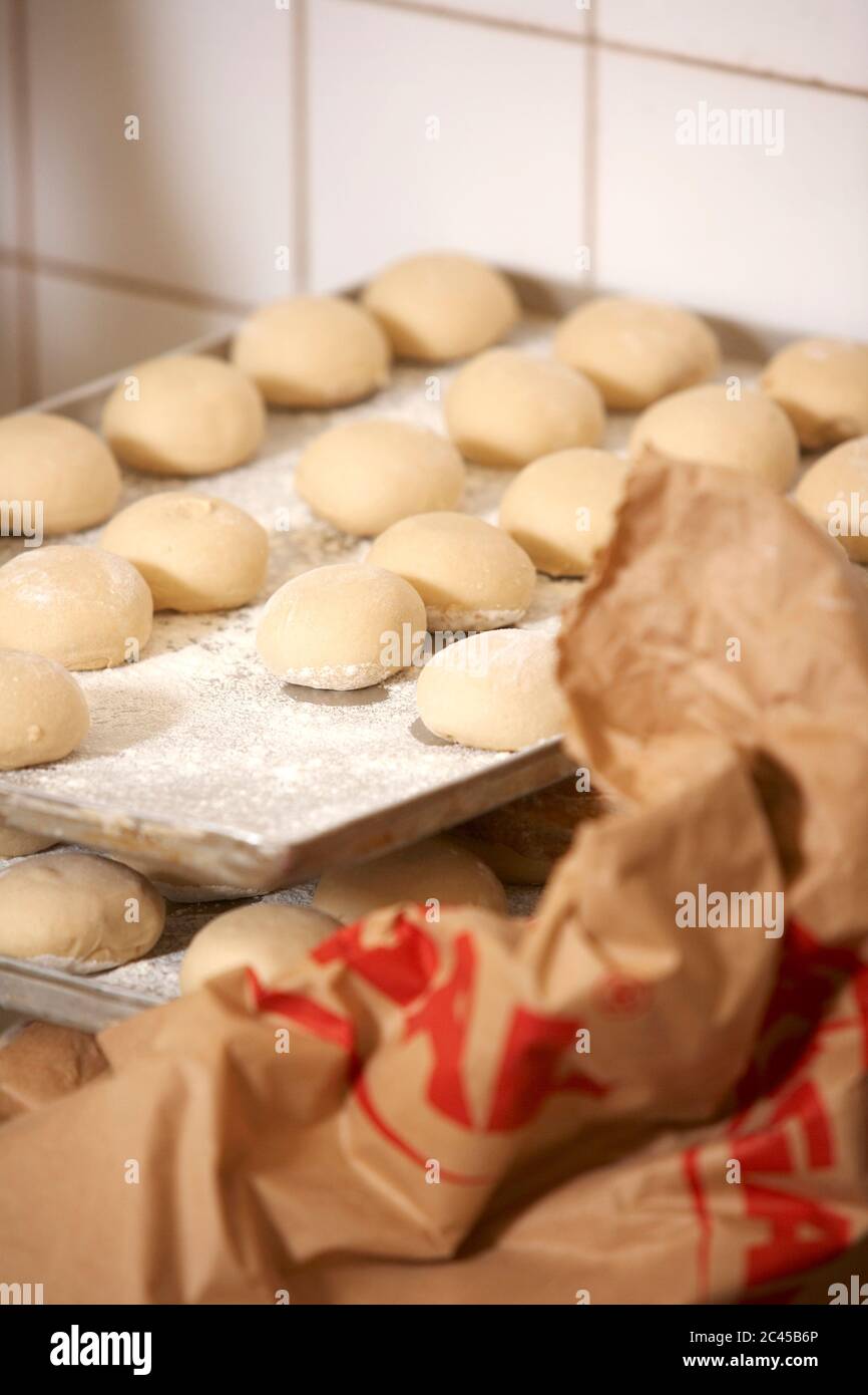 Raw rolls in a bakery Stock Photo - Alamy