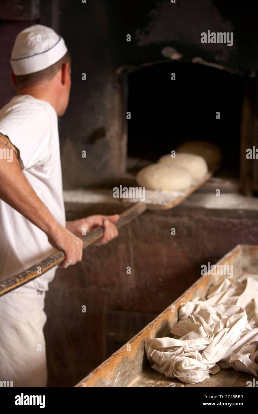 Baker at work Stock Photo - Alamy