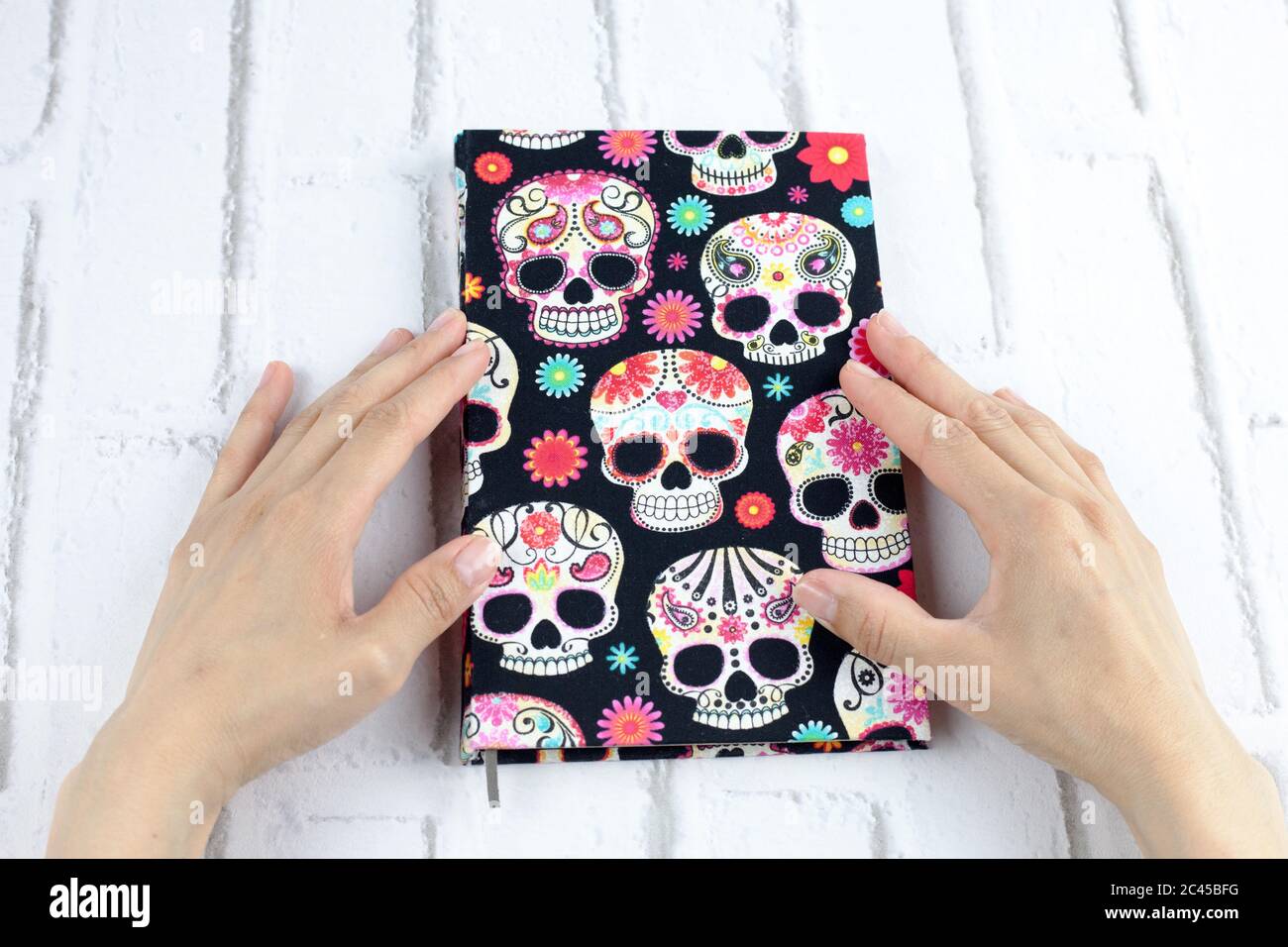 Handmade notebook with skulls fabric cover Stock Photo - Alamy