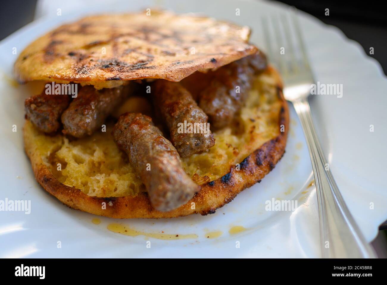 Traditional Bosnian dish with meat and bread Stock Photo - Alamy