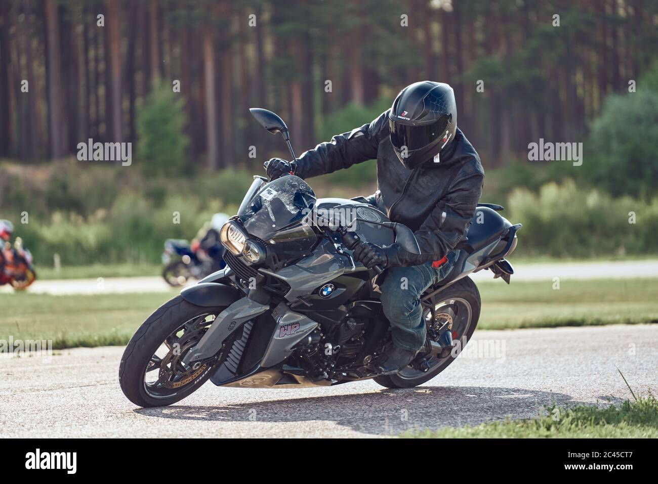 11-05-2020 Riga, Latvia. Motor biker on a race circuit speeding round a ...