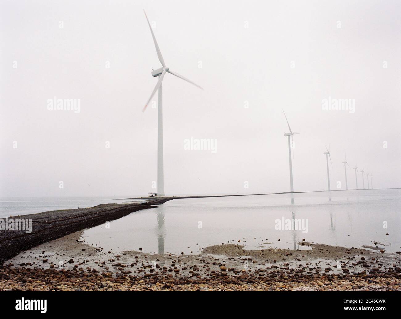 Wind farm by the sea Stock Photo - Alamy