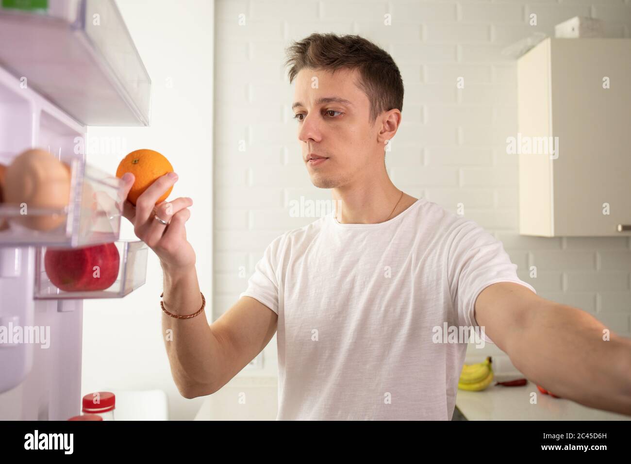 Camera Inside Kitchen Fridge: Man Opens Fridge Door, Looks inside Stock ...