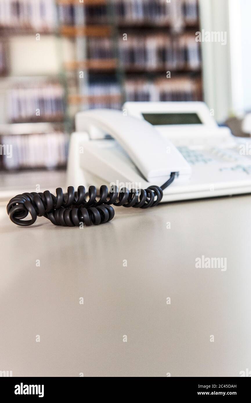 Telephone on a desk in the office Stock Photo - Alamy