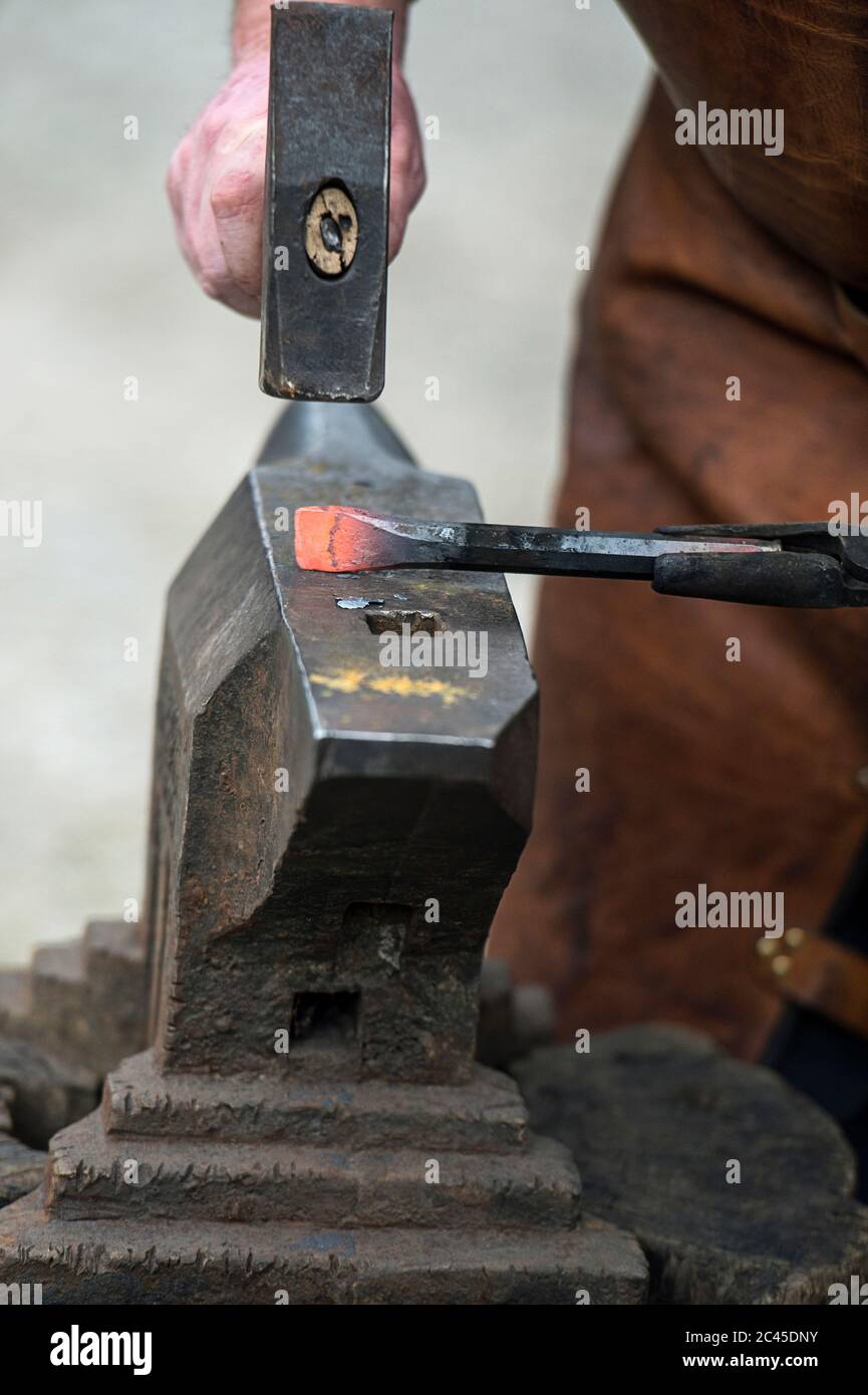 Blacksmith at work Stock Photo - Alamy