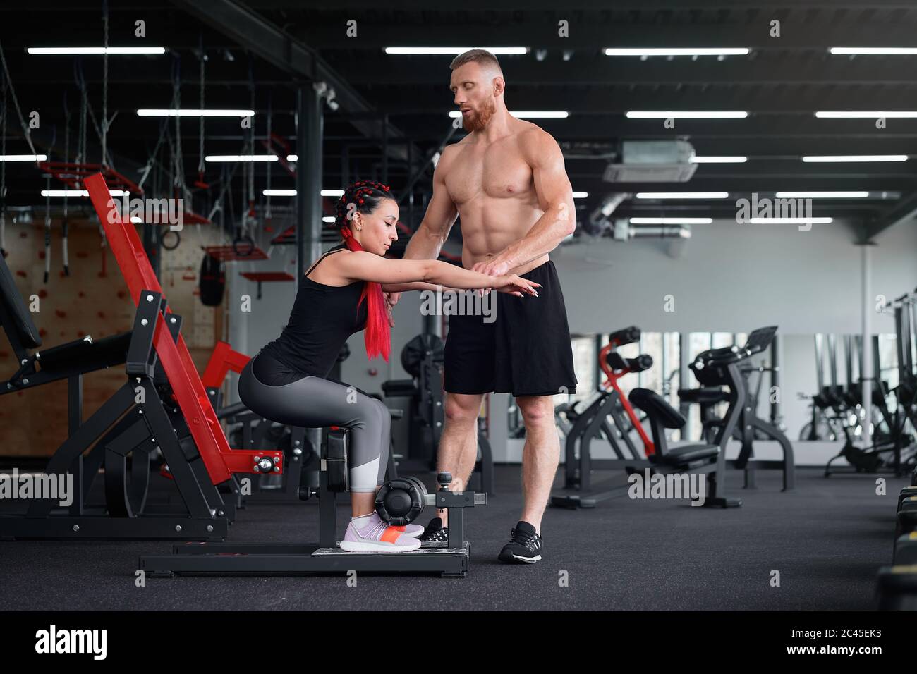 Personal trainer coach instructor athlete sportive man woman gym ...