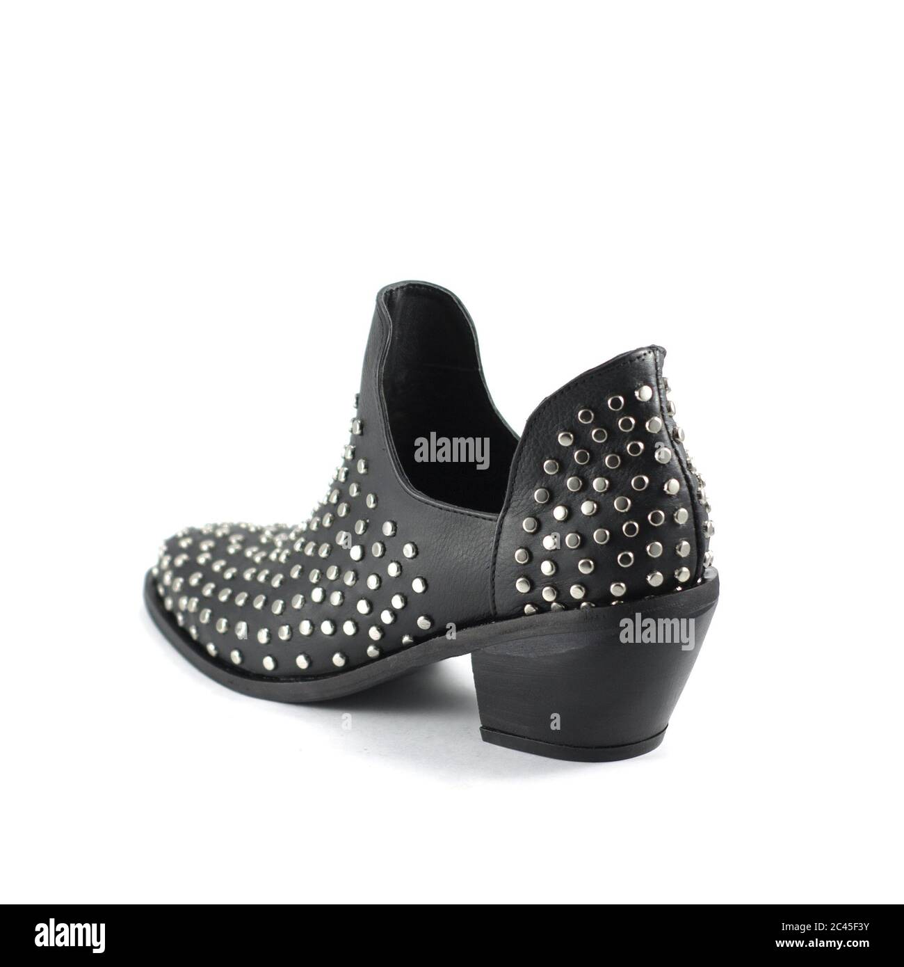 Shot of elegant and beautiful black leather heel with metal stones ...