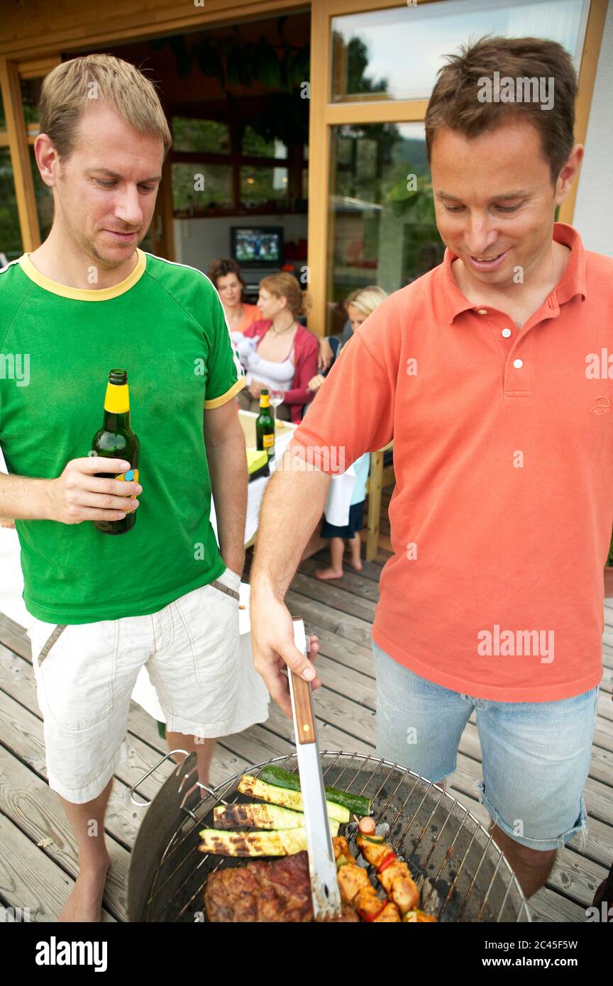 Two man standing food hi-res stock photography and images - Alamy