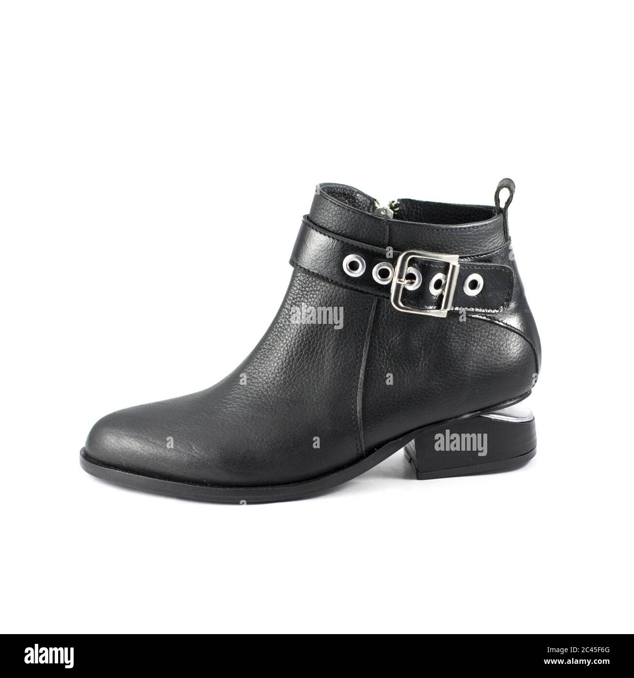 Shot of a black leather heel decorated with leather belt isolated on a ...