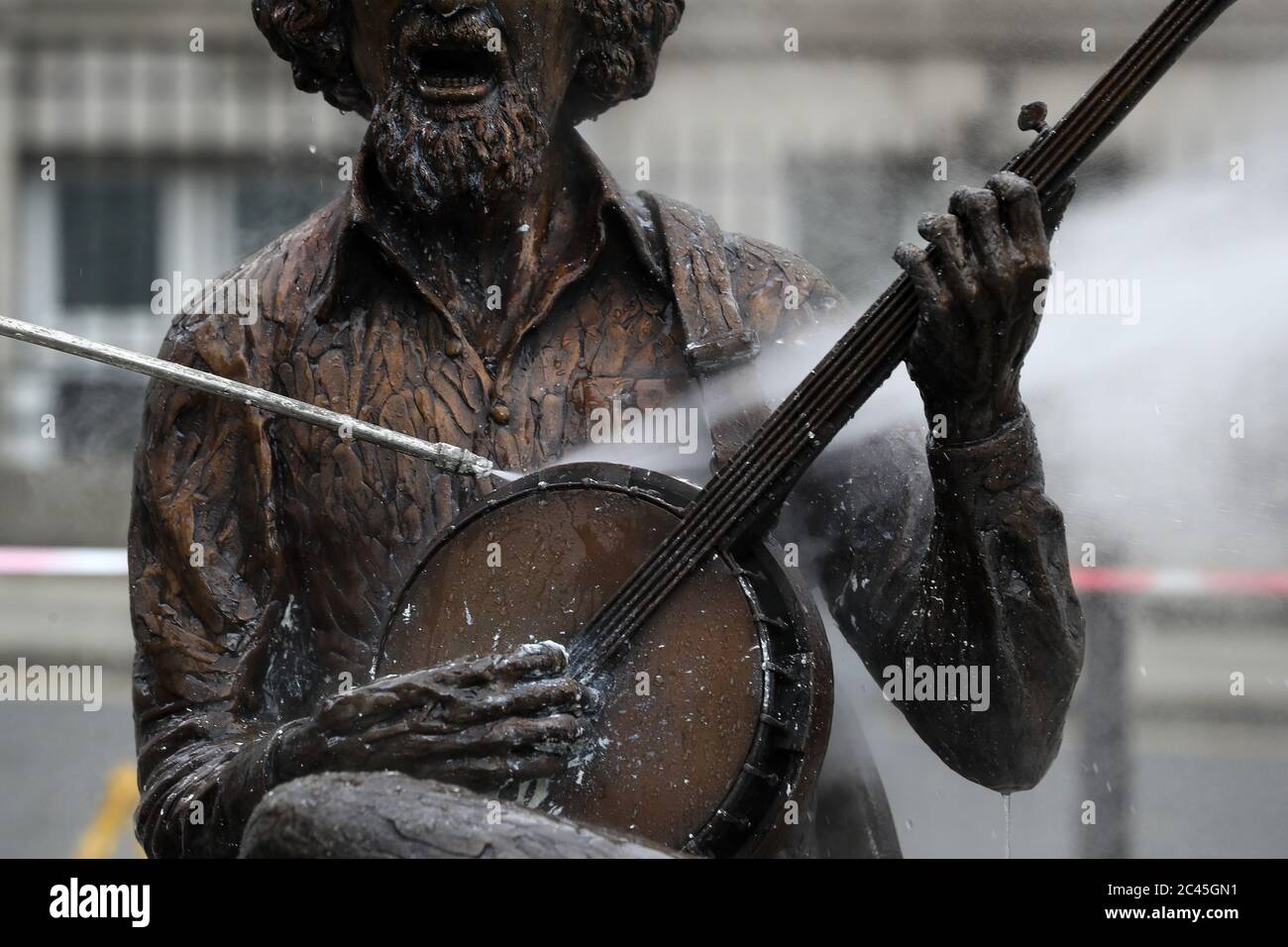 A statue of the late musician Luke Kelly on King Street South in Dublin ...