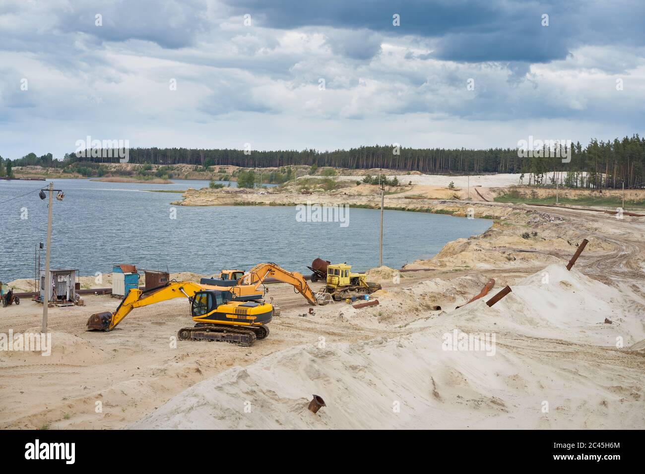 Sand quarry mining industry equipment excavator tractor standing sand ...