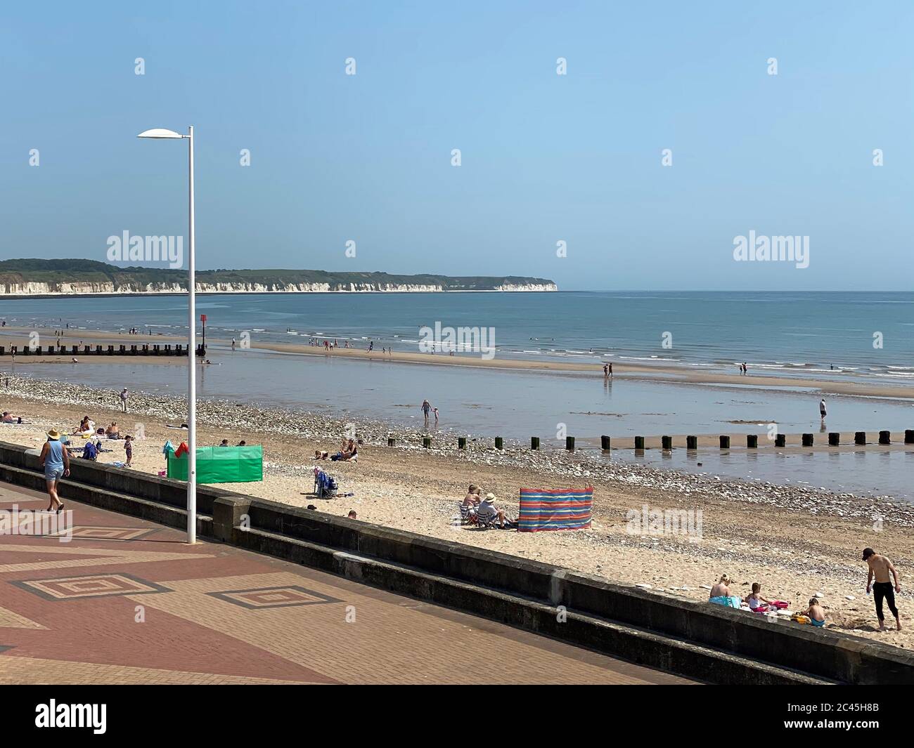People enjoy the warm weather on Bridlington beach in North Yorkshire ...