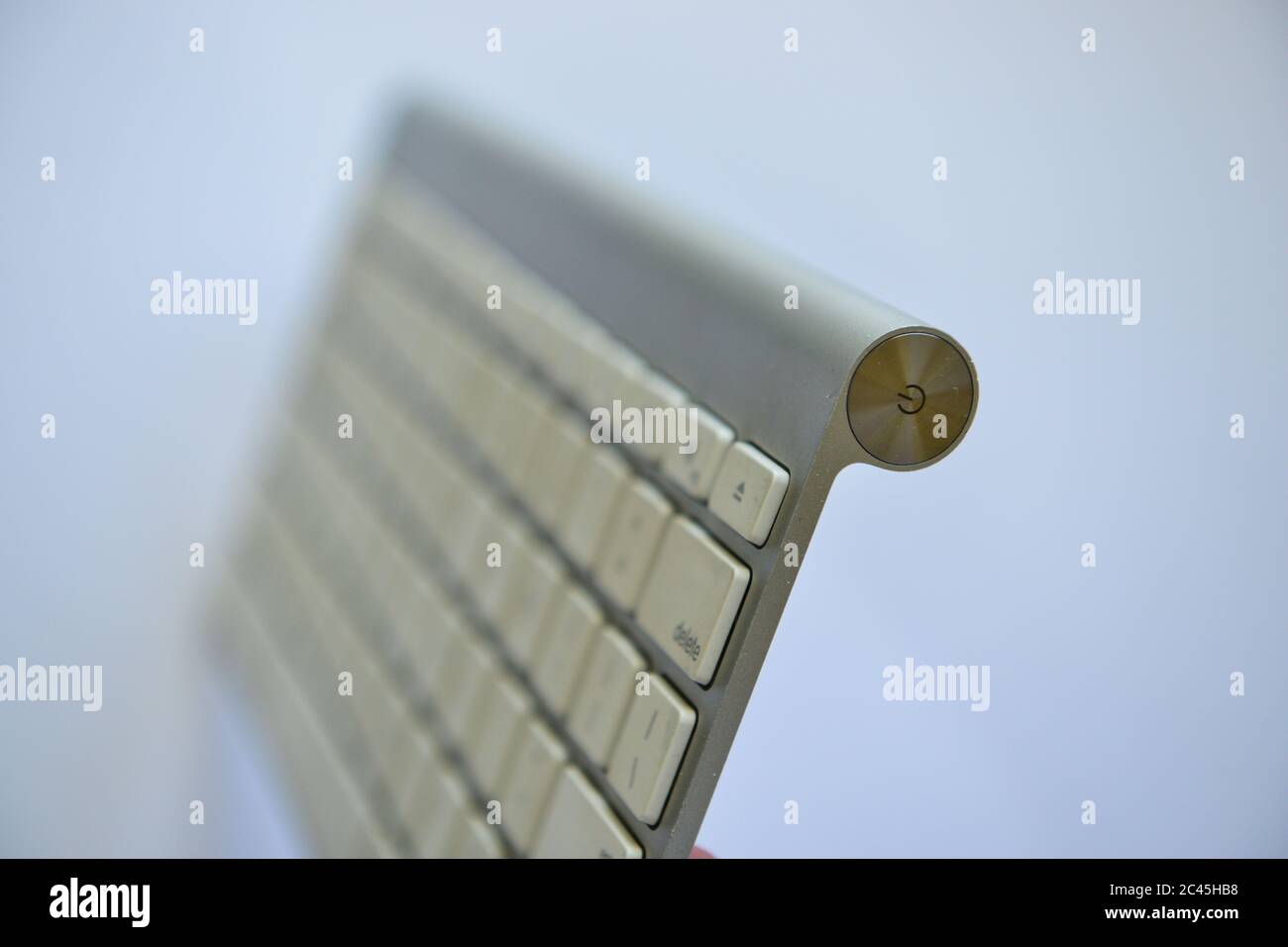 White Aluminum Keyboard with mobile and muse on white background Stock ...